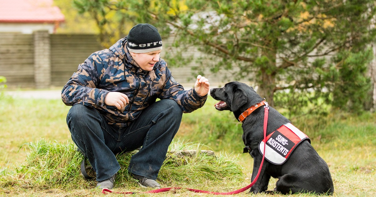Kirils gets to know the world around him with the help of a guide dog